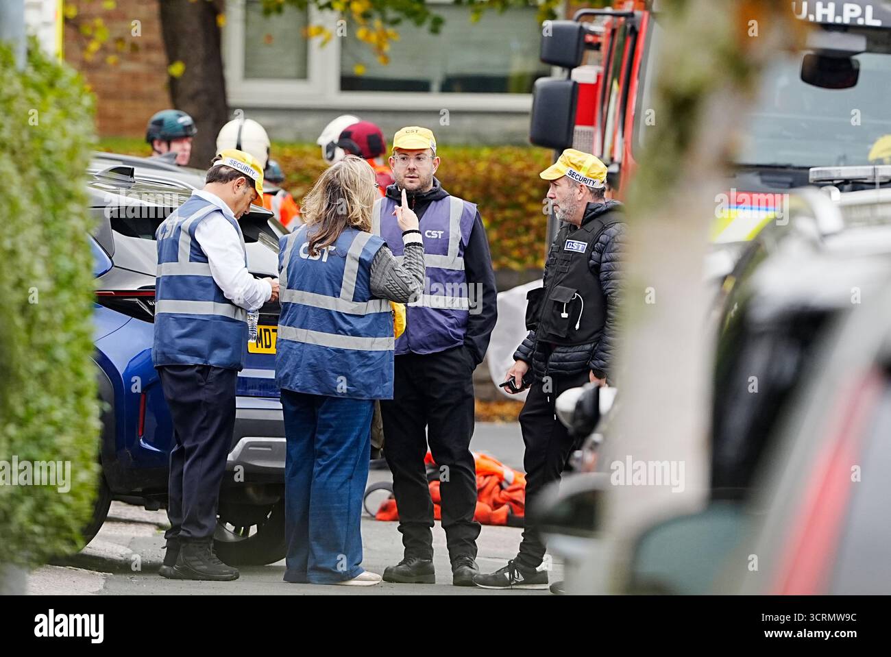 Members of the Community Security Trust (CST) at the scene of an ...