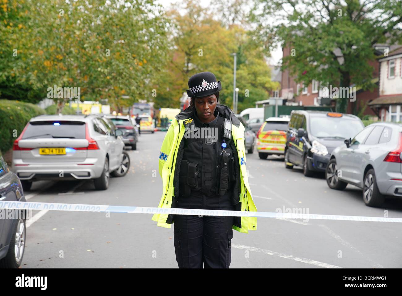 A police officer on duty at the cordon near the scene of an incident at ...