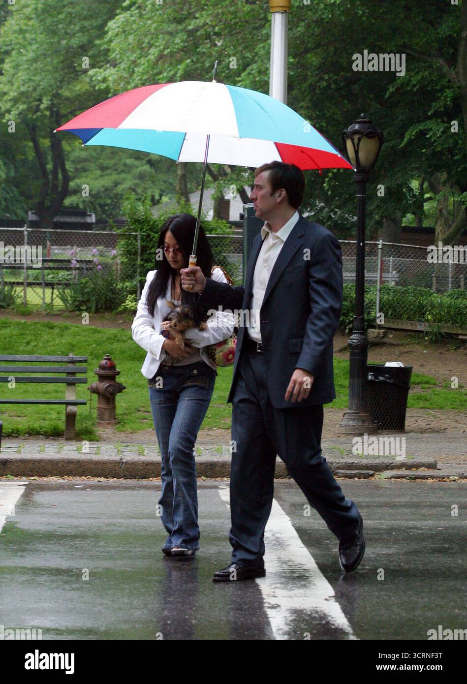 Nicolas Cage and his girlfriend Alice Kim taking a break from filming a ...