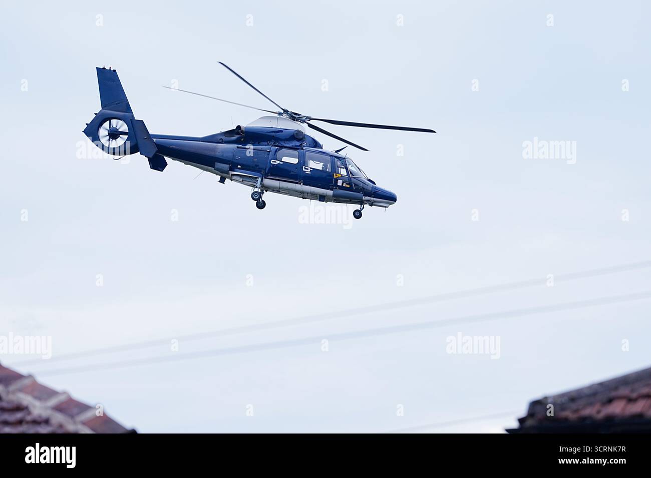 The SAS 'Blue Thunder" helicopter flies above the scene at the Heaton ...