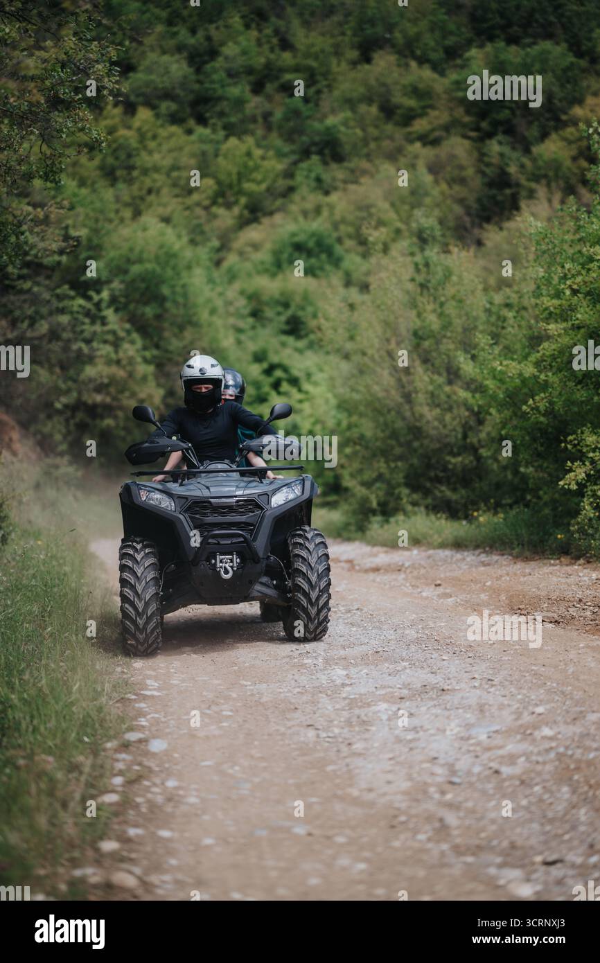Two friends riding atv hi-res stock photography and images - Alamy