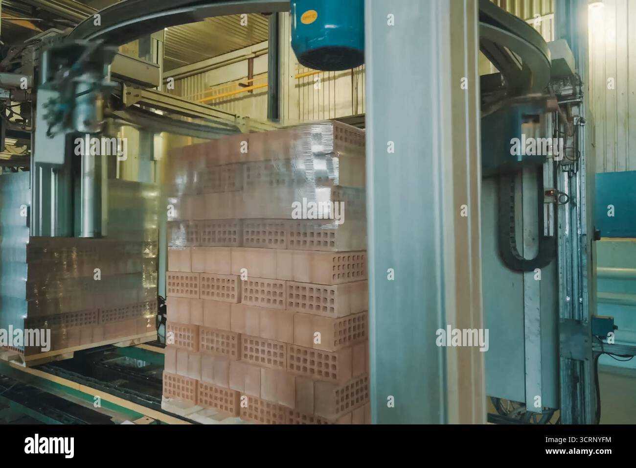 Wrapping a transport film of a brick pallet. Brick production, hollow ...