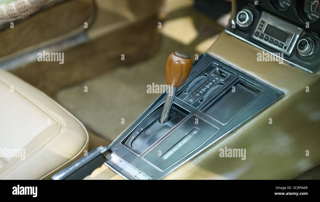 Vintage car interior featuring wooden gear shift, tan leather ...