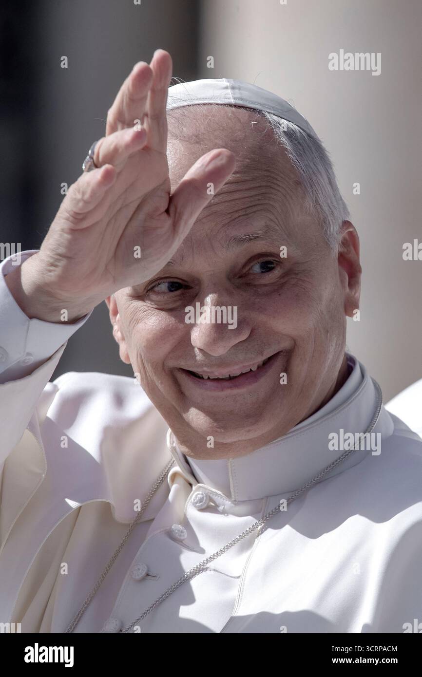 Pope Leo XIV waves as he leaves at the end of his weekly general ...