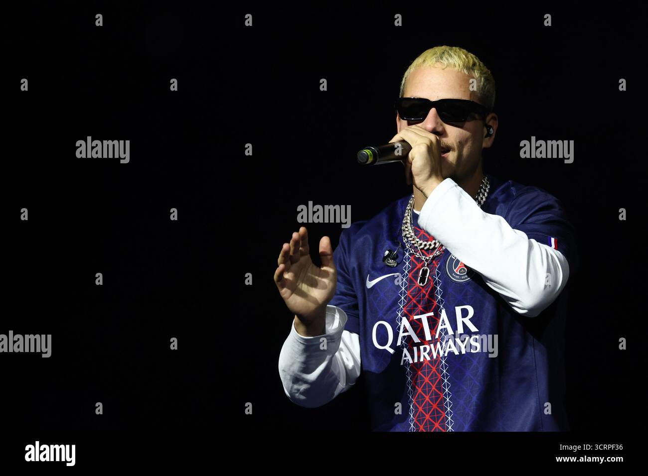French rapper PLK performs after the French L1 football match between Paris Saint-Germain (PSG ...