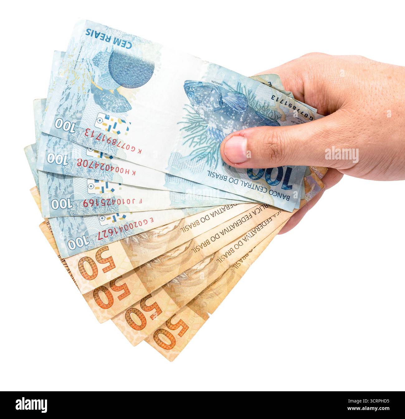 hand holding Brazilian money banknotes, 100 Brazilian real notes ...