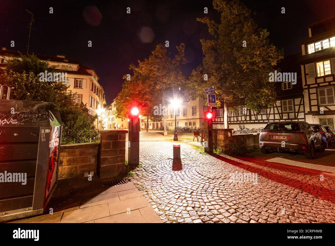 Automated traffic control bollard with warning lights at night ...