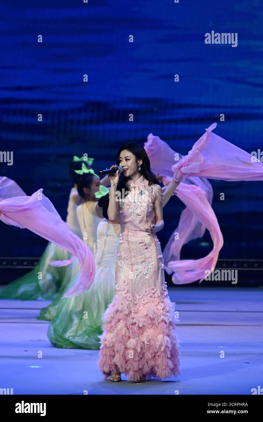 China's singer Wu Keyue singing on the stage at China’s National ...