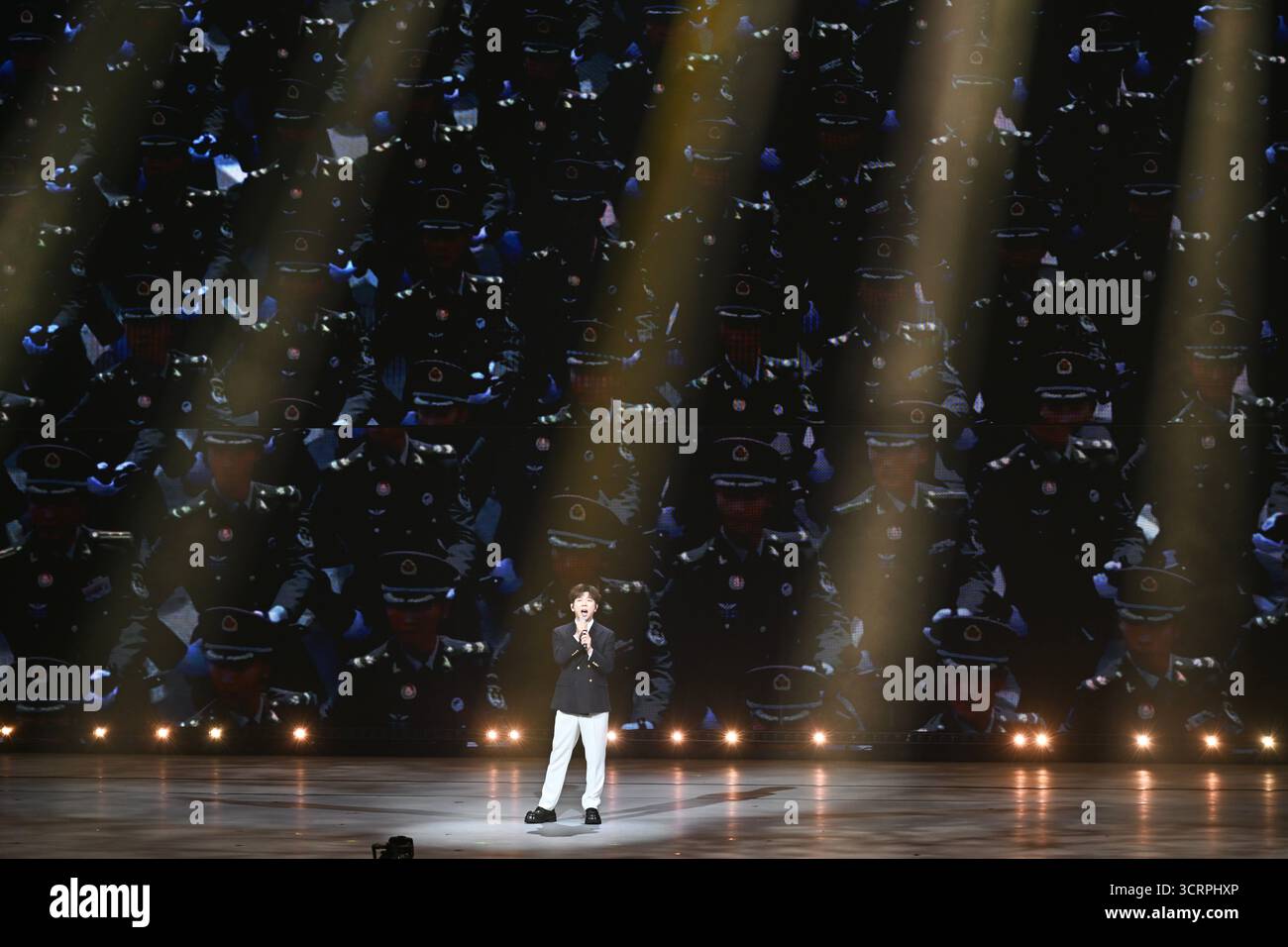 China's singer Hu Haiquan singing on the stage at China’s National ...