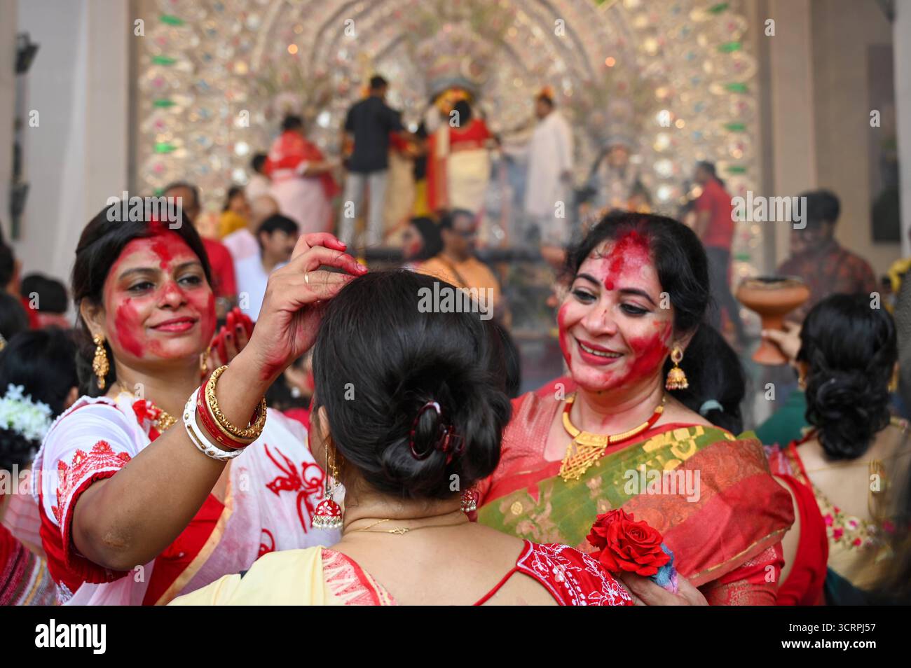 GURUGRAM, INDIA - OCTOBER 2: Women apply sindoor on each other s faces ...
