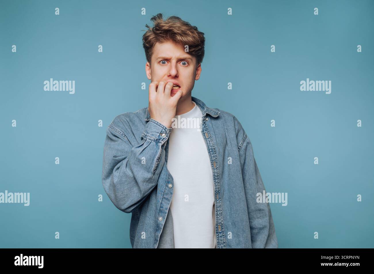 Young man wearing blue jacket hi-res stock photography and images - Alamy