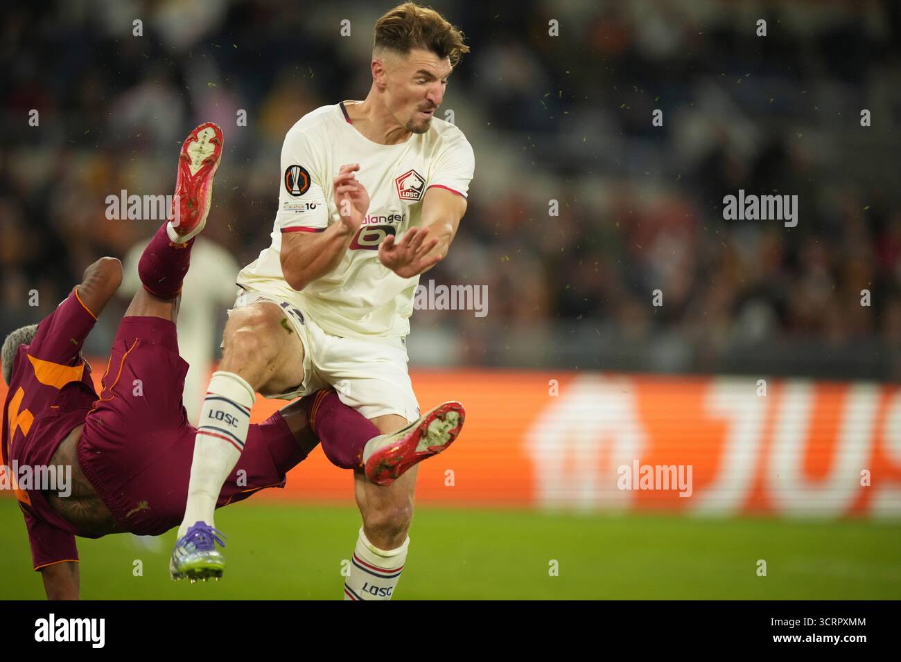 Roma's Wesley challenges for the ball with Lille's Thomas Meunier ...
