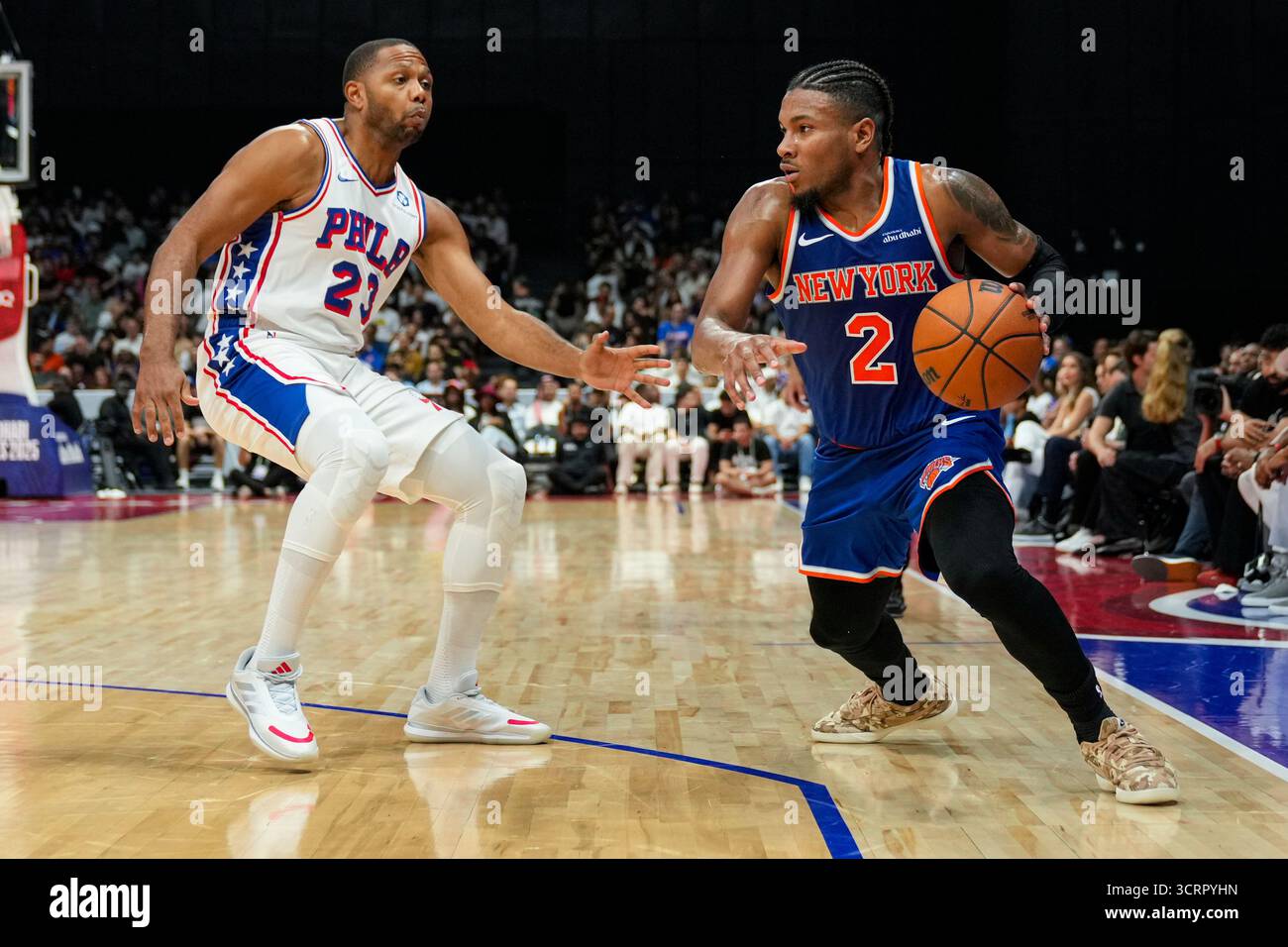 New York Knicks' Miles McBride drives on Philadelphia 76ers' Eric ...