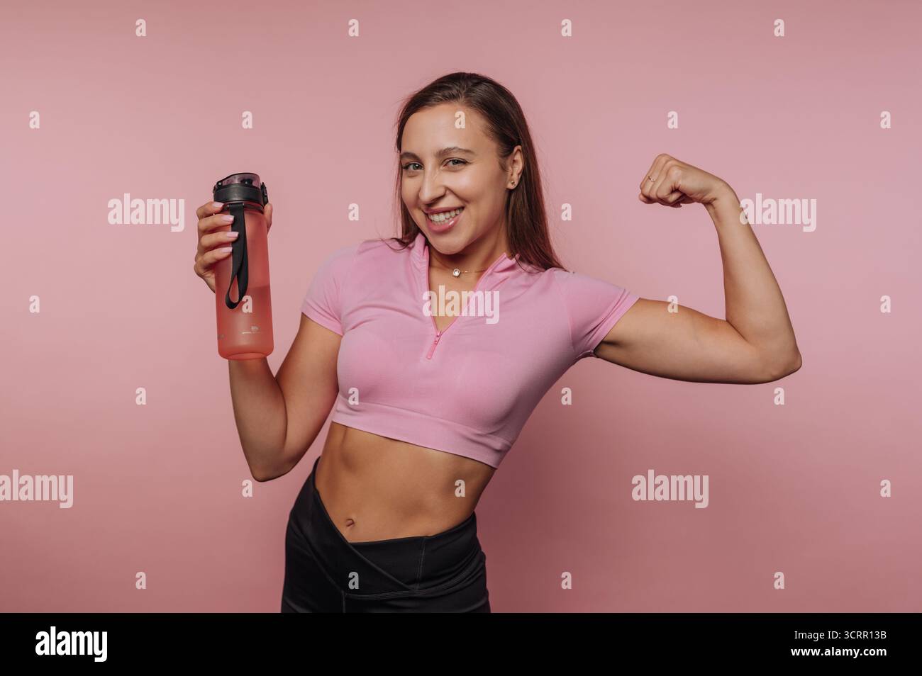 Woman flexes arm showing biceps hi-res stock photography and images - Alamy