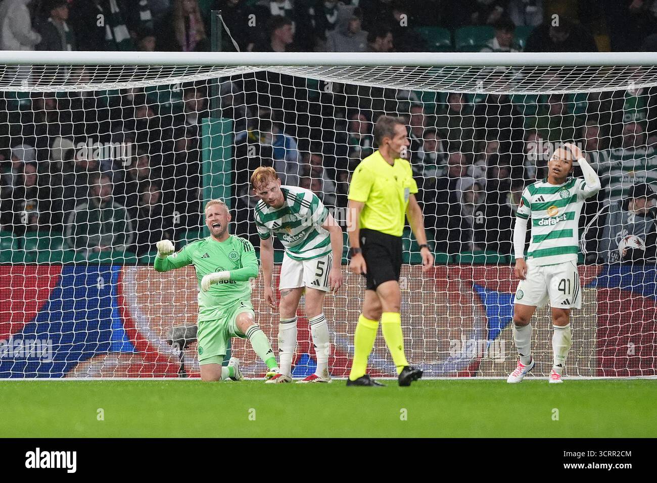 Celtic goalkeeper Kasper Schmeichel (left) and team-mates react after ...