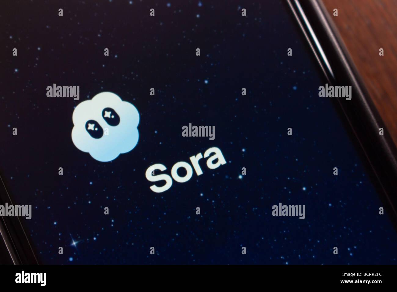 Smartphone displaying Sora app launch screen with a starry night ...