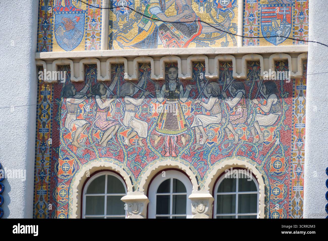 Colourful mural and ornate architectural details on a historic building ...