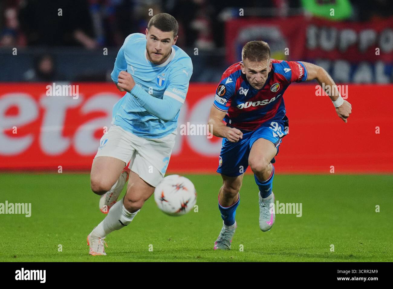 Plzen's Amar Memic and Malmo's Gabriel Busanello challenge for the ball ...
