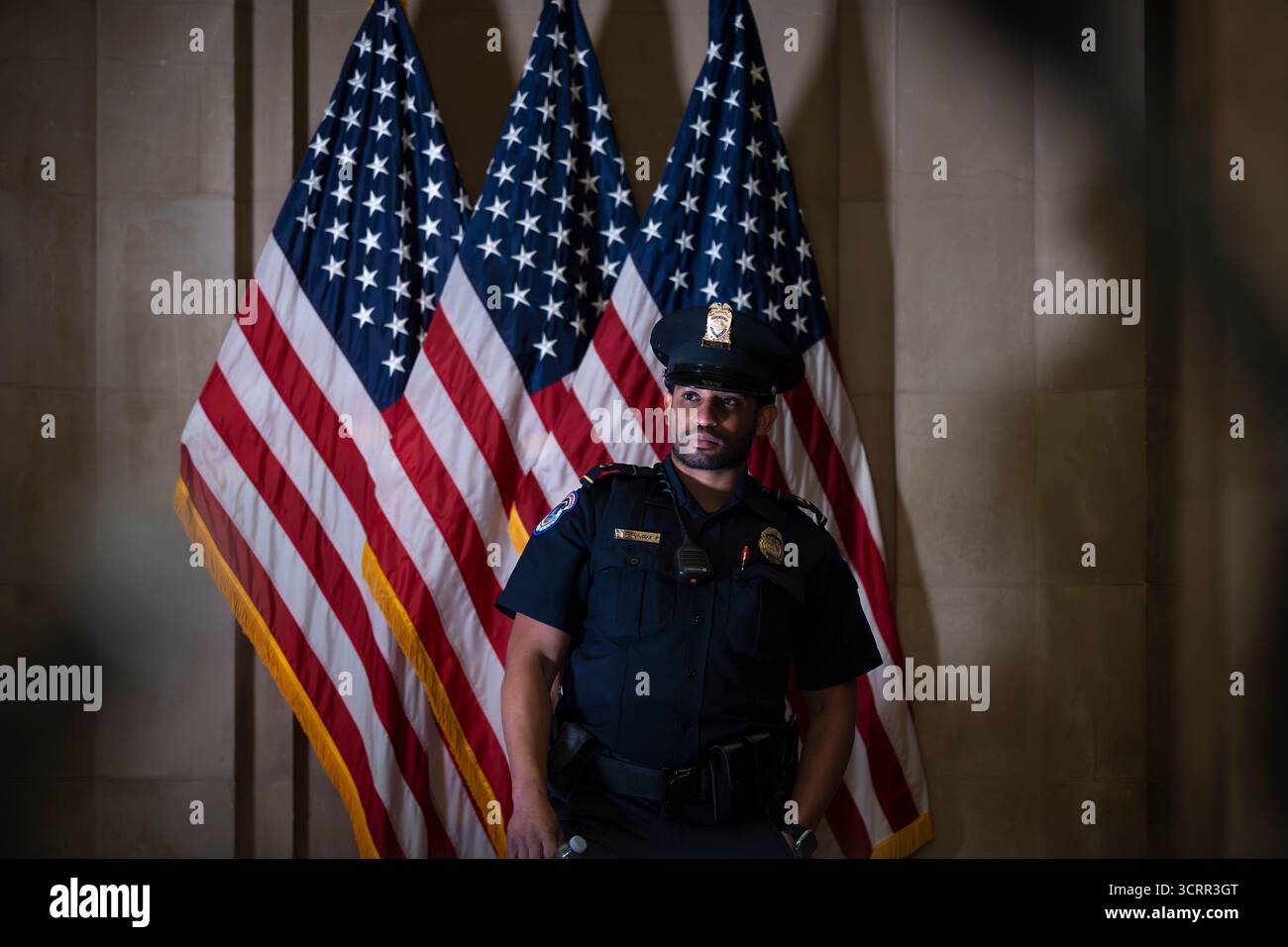 A U.S. Capitol Police officer guards the entrance to the office of ...