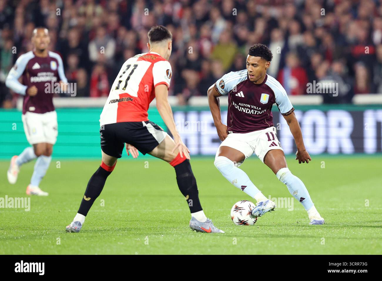 Aston Villa's Ollie Watkins (right) and Feyenoord's Anel Ahmedhodzic ...