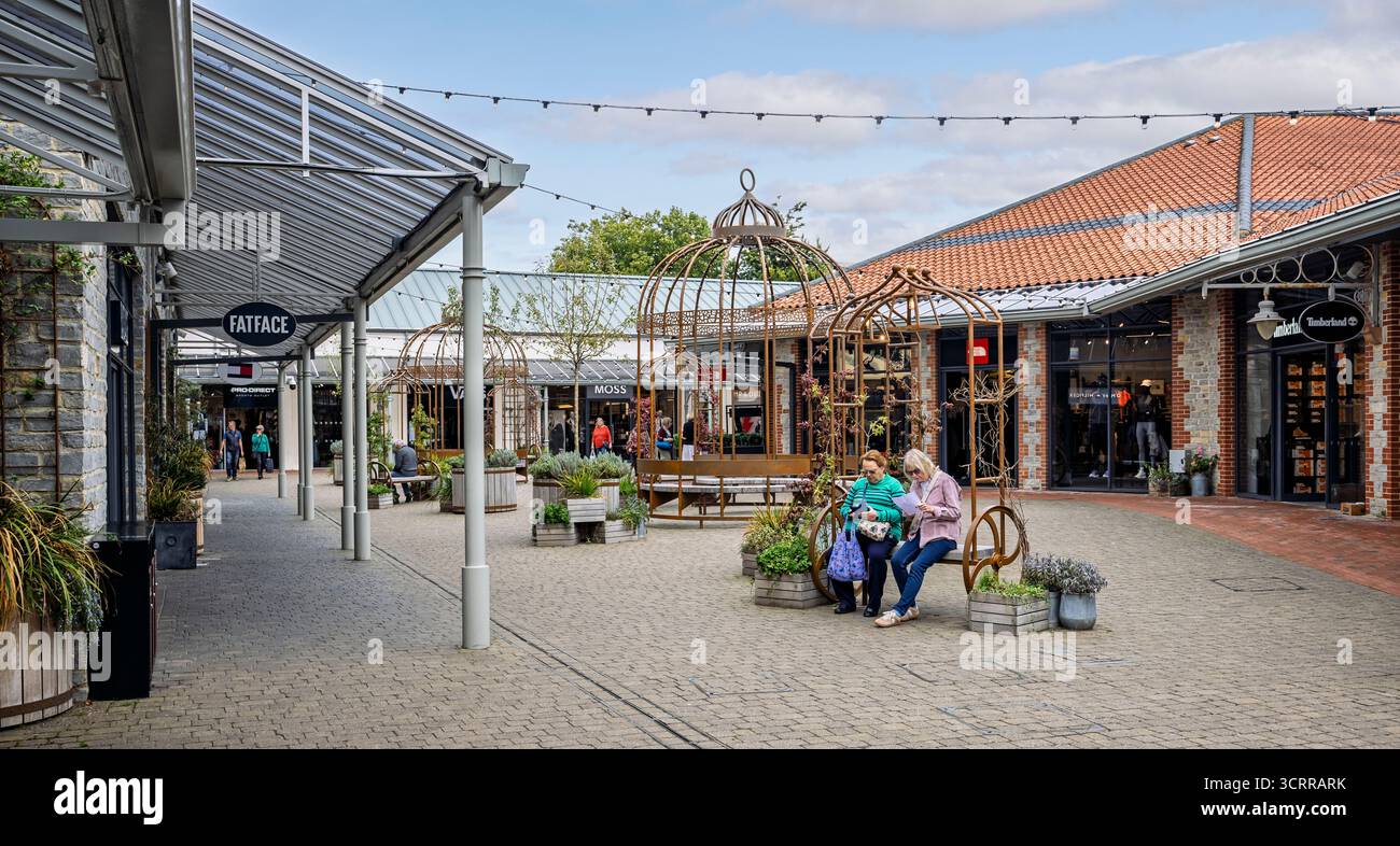 Shops, restaurants and outdoor seating area in centre of Clarks Village ...