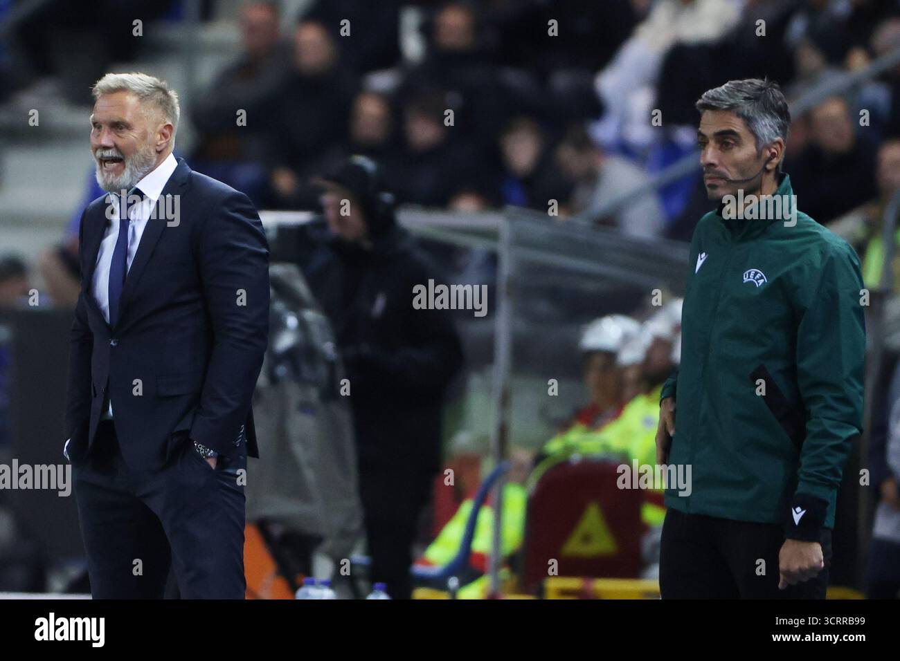 Genk's head coach Thorsten Fink, left, during the Europa League opening ...