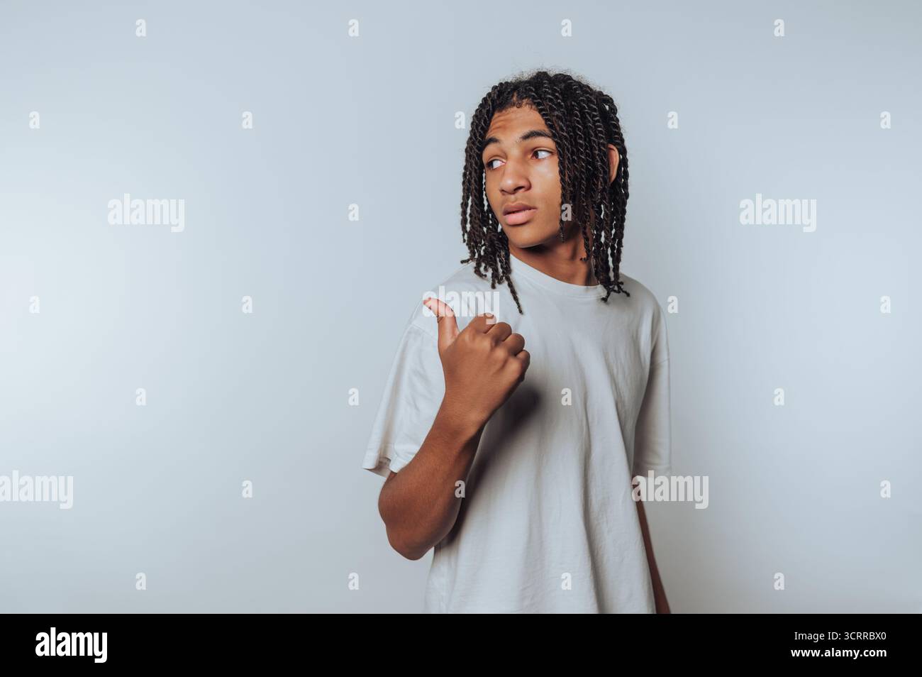 Man pointing thumb over shoulder hi-res stock photography and images ...