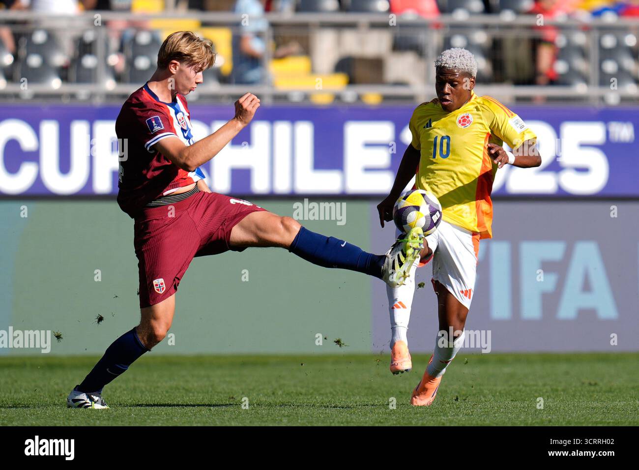 Norway's Jonathan Norbye blocks an advance by Colombia's Oscar Perea ...