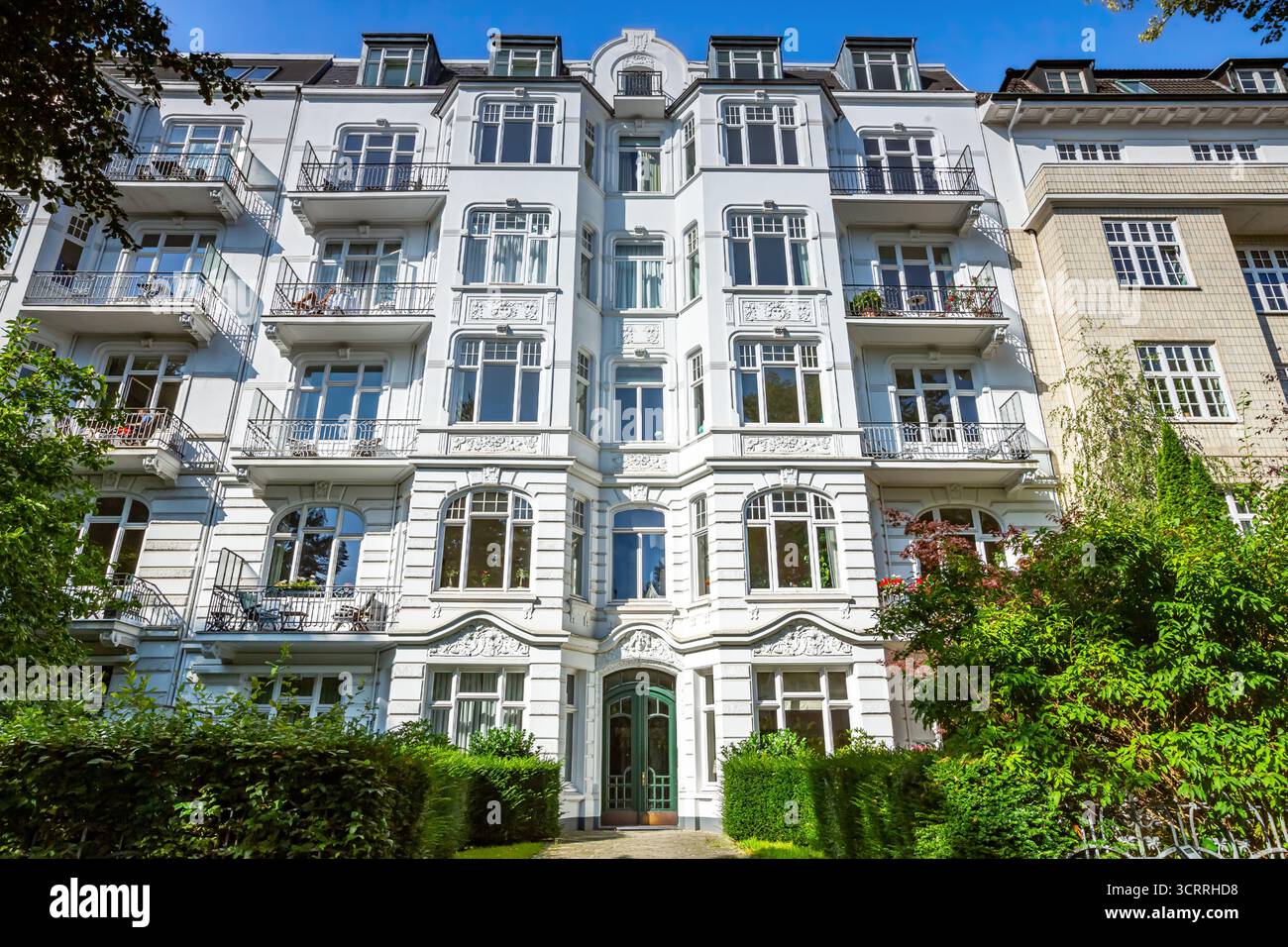 The residential white building entrance with amazing decorations on the ...