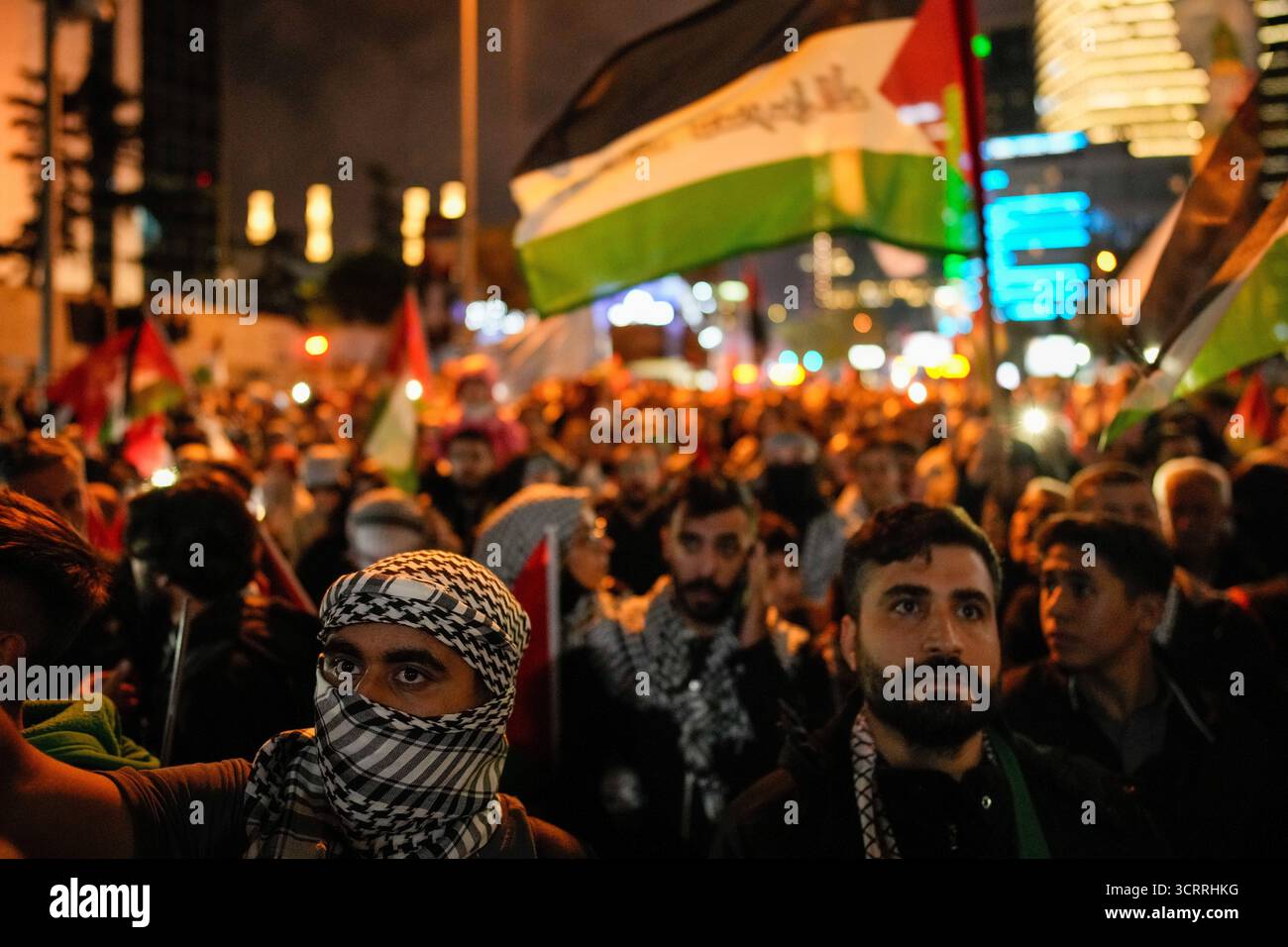 People gather in front of the Israel consulate during a protest against ...