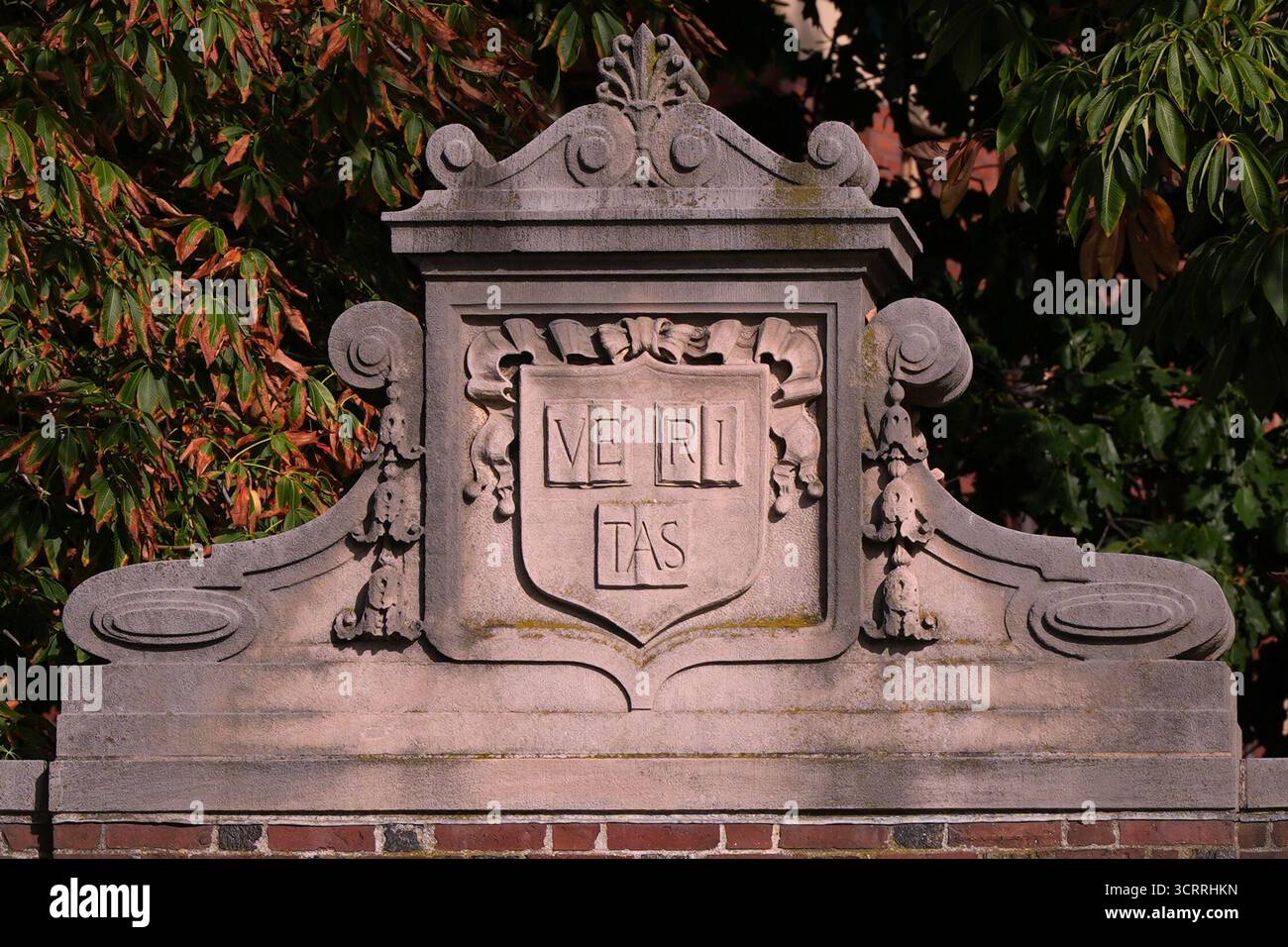The "Veritas" crest on a gate leading to Harvard Yard at Harvard ...