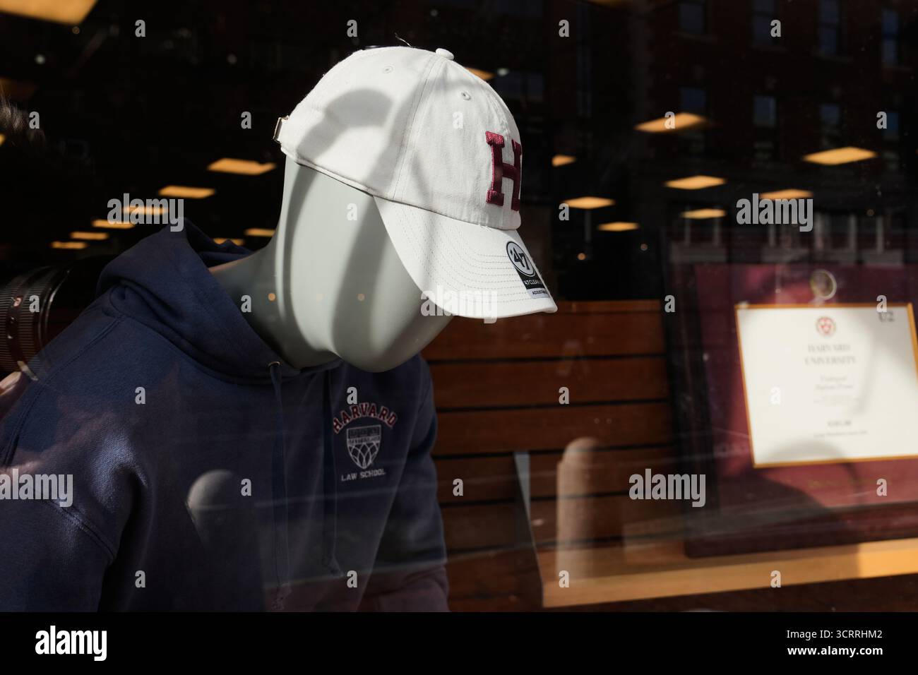 A mannequin dressed in Harvard University clothing is displayed at a ...