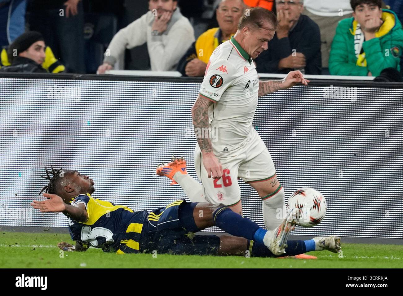 Nice's Melvin Bard, top, fights for the ball with Fenerbahce's Dorgeles ...