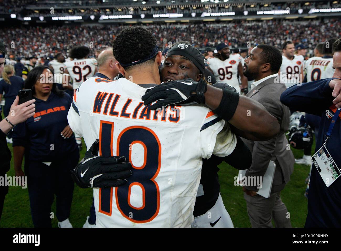 Las Vegas Raiders running back Ashton Jeanty (2) embraces Chicago Bears ...