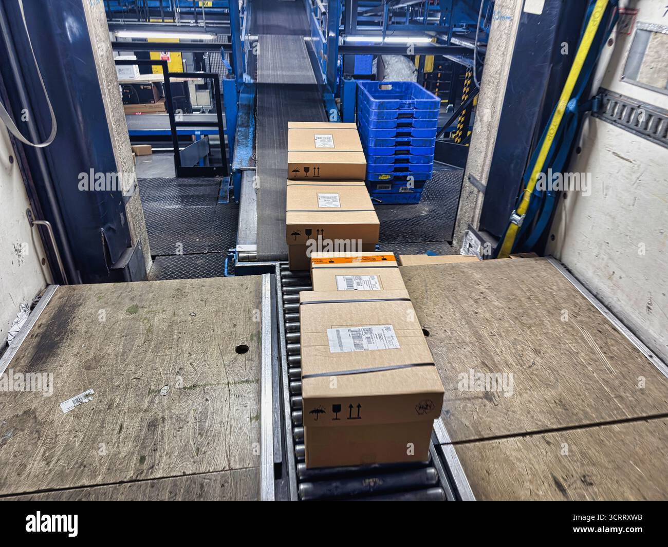 Warehouse parcel shipping process with packages on conveyor belt being ...