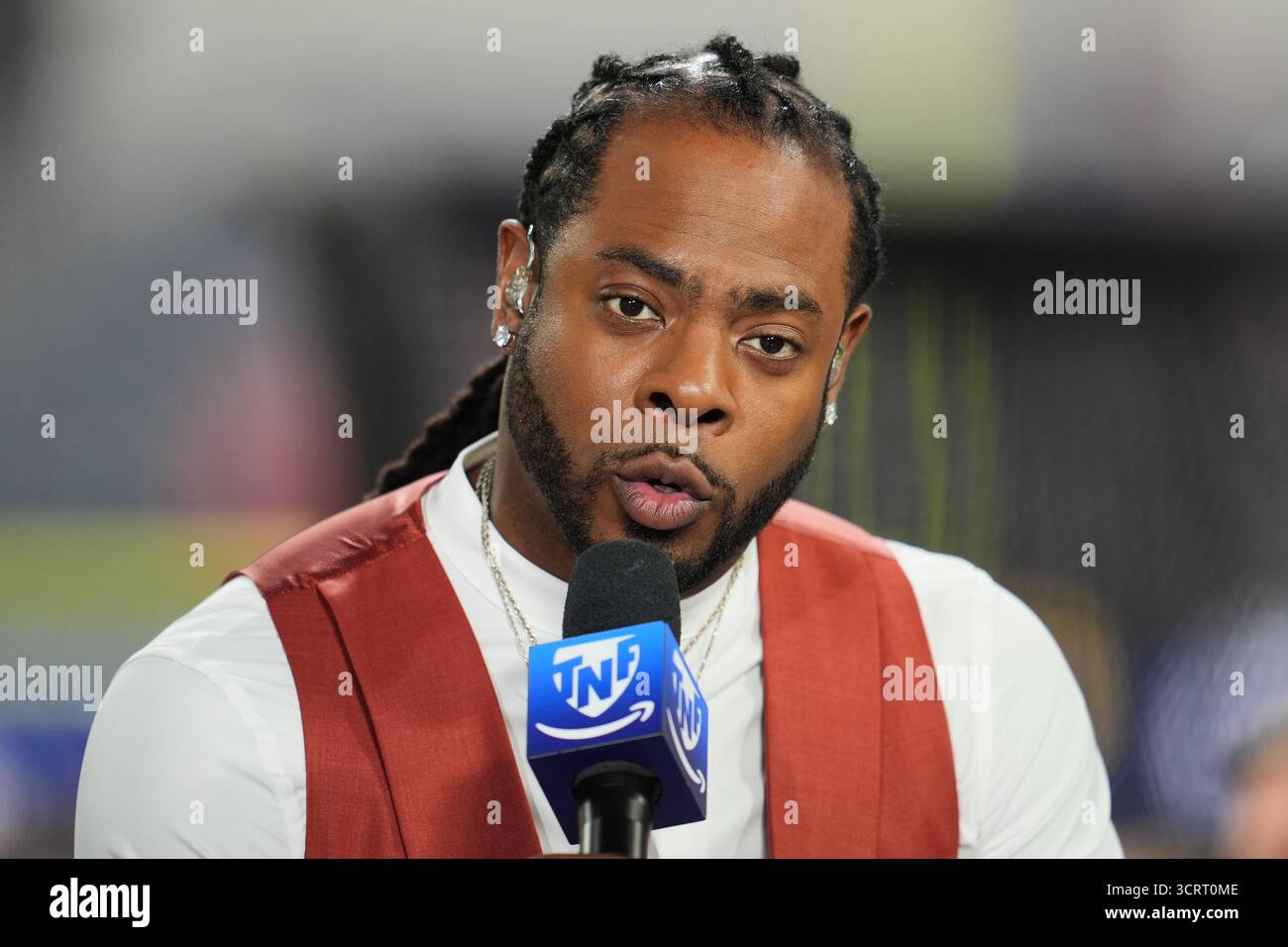 Former player Richard Sherman is shown before an NFL football game ...
