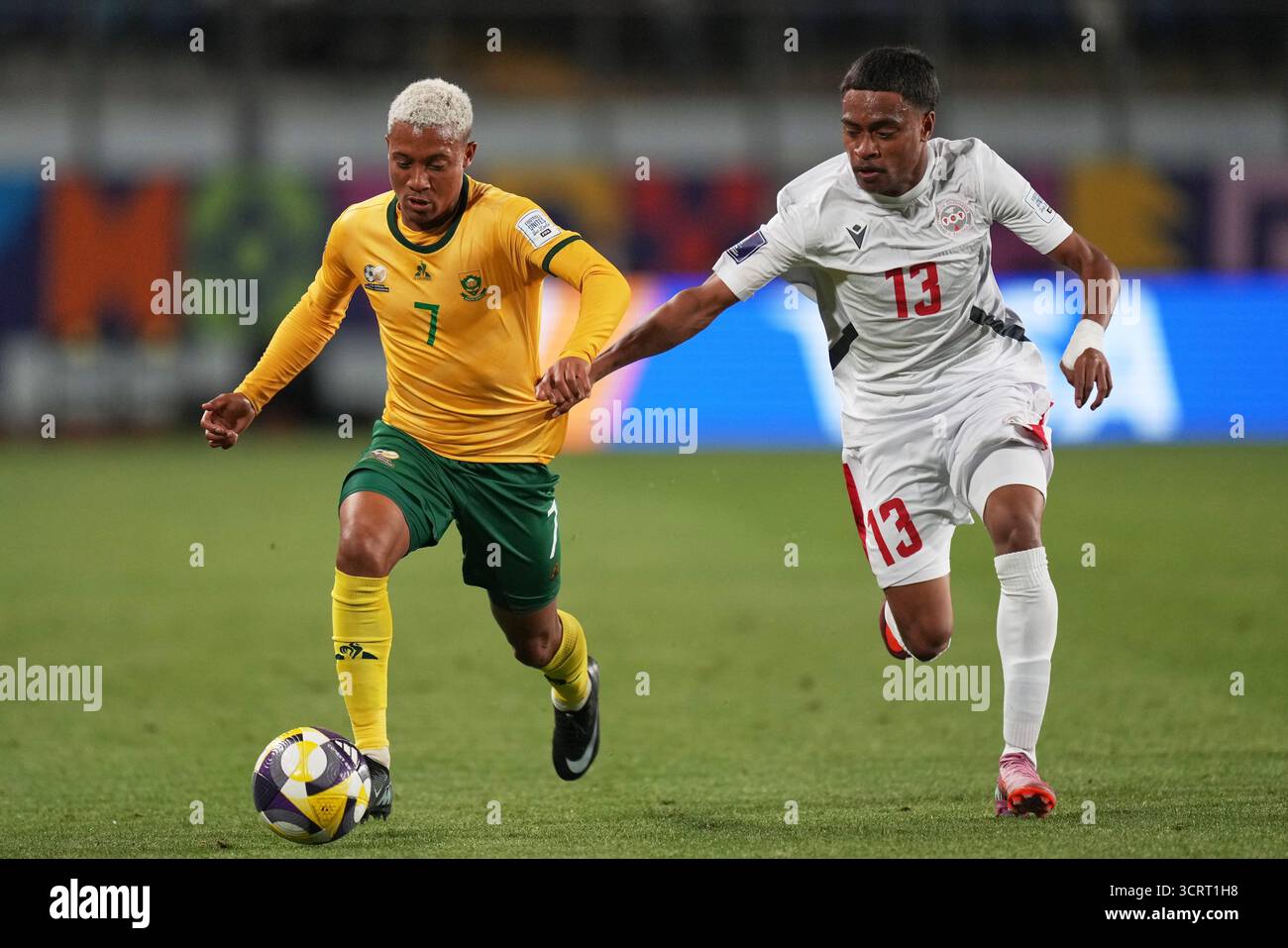 South Africa's Shakeel April, left, and New Caledonia's Damien Ujicas ...