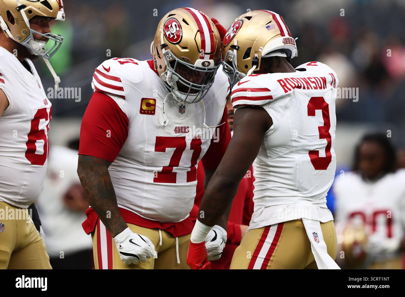 San Francisco 49ers Trent Williams (71) and running back Brian Robinson ...