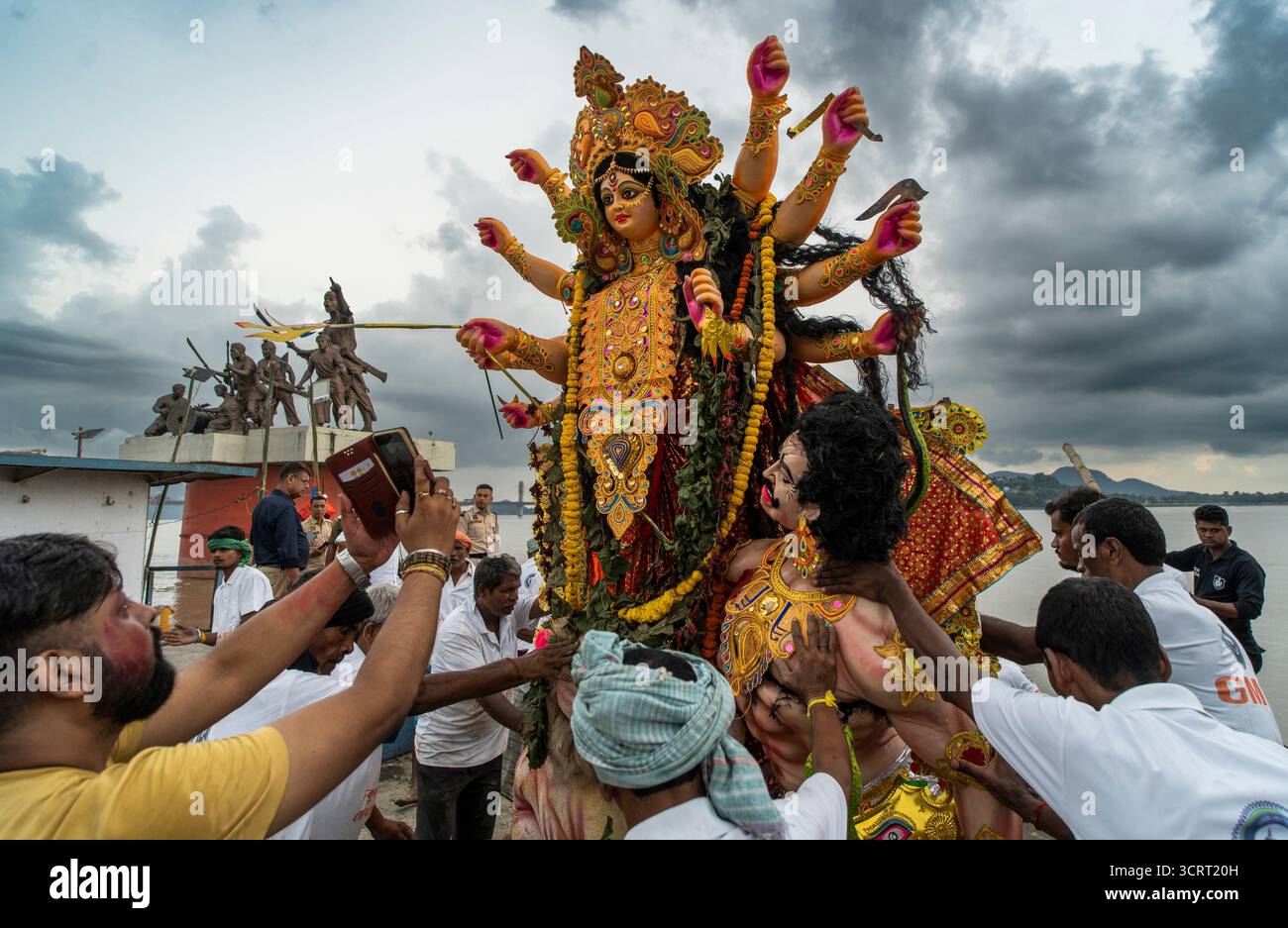 October 2, 2025: Municipal workers push a clay idol of Goddess Durga to ...