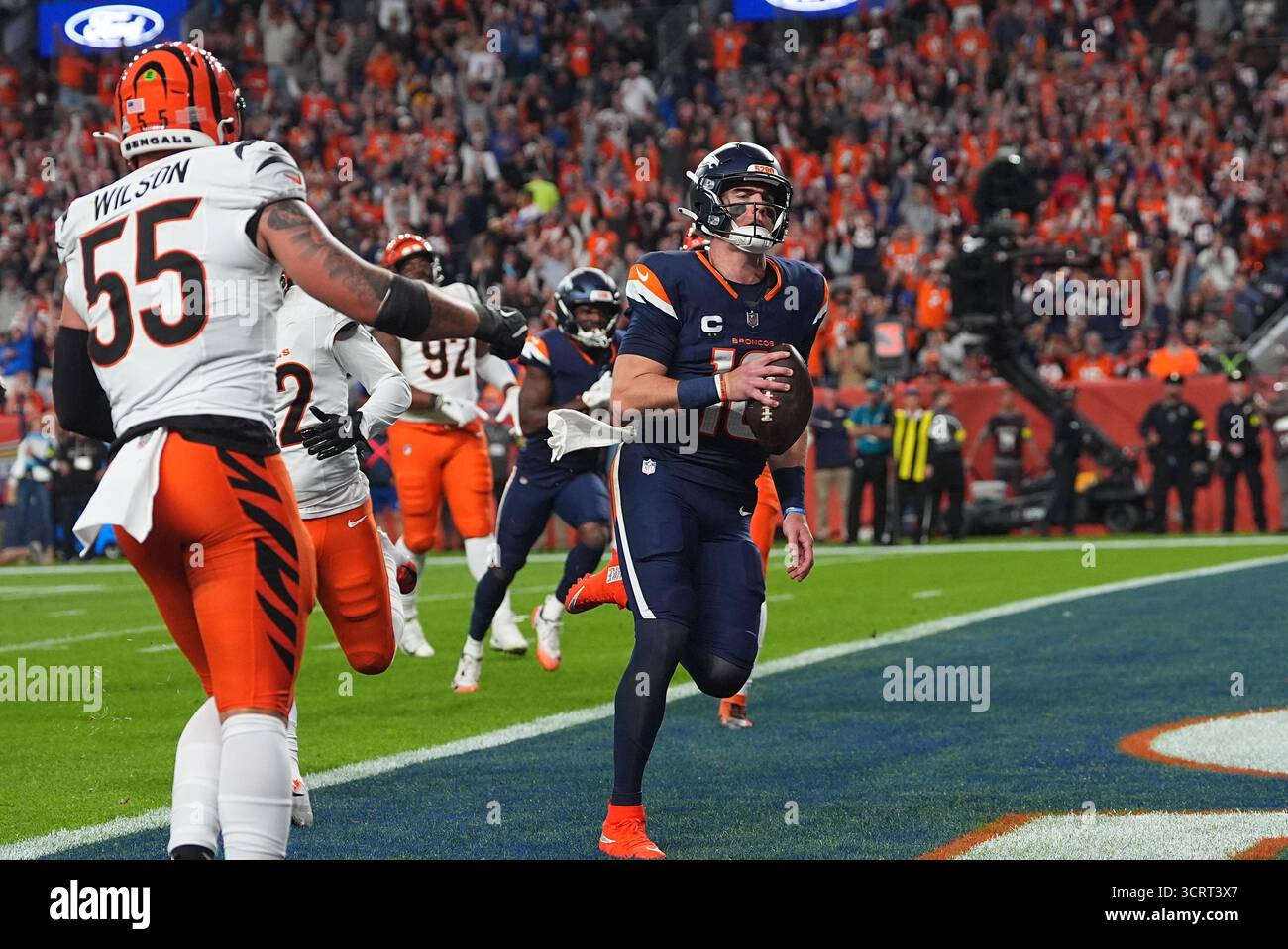 Denver Broncos quarterback Bo Nix (10) runs for a touchdown past ...