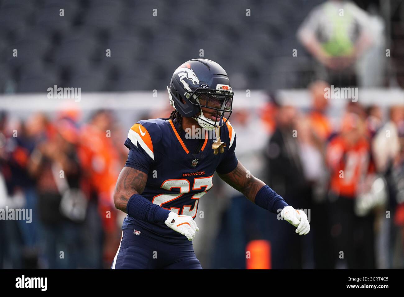 Denver Broncos cornerback Jahdae Barron warms up before an NFL football ...