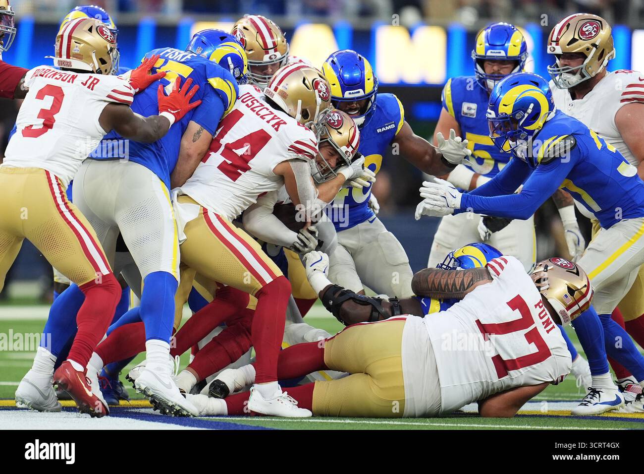 San Francisco 49ers quarterback Mac Jones, middle, runs for a first ...