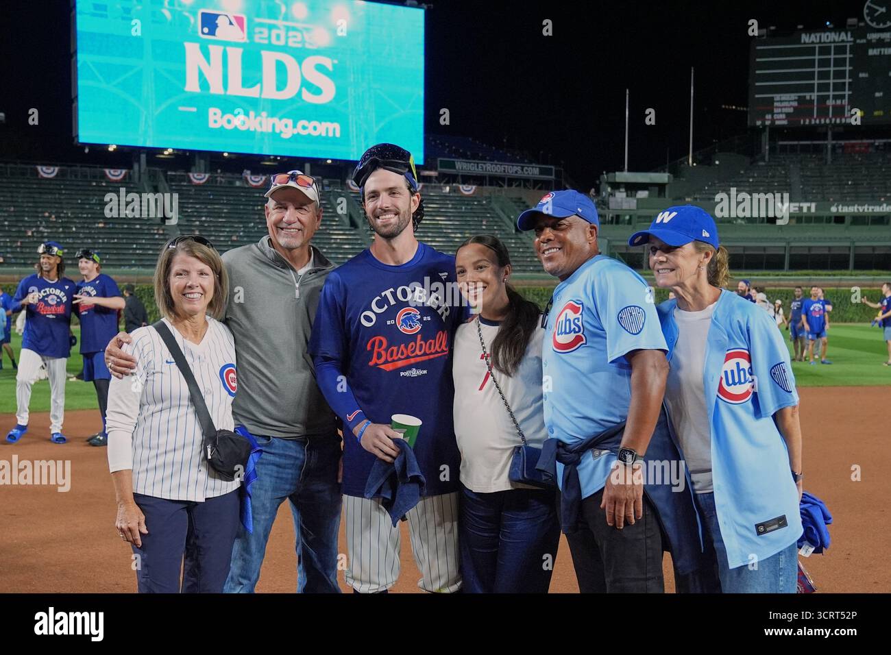 Chicago Cubs' Dansby Swanson poses for a picture with his family after ...