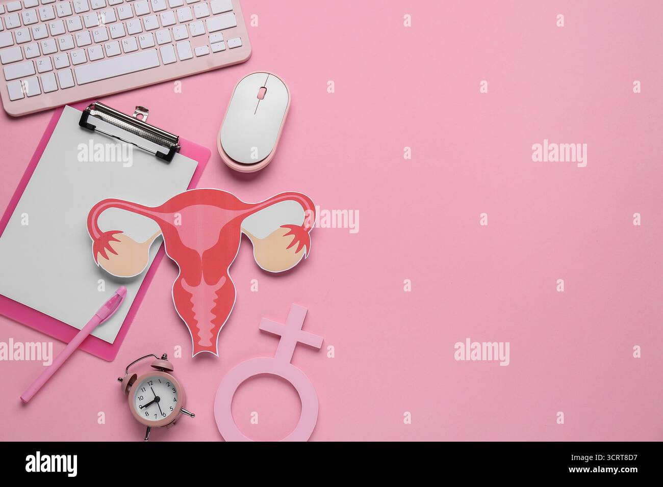 Paper uterus with alarm clock, symbol of woman, clipboard, keyboard and ...