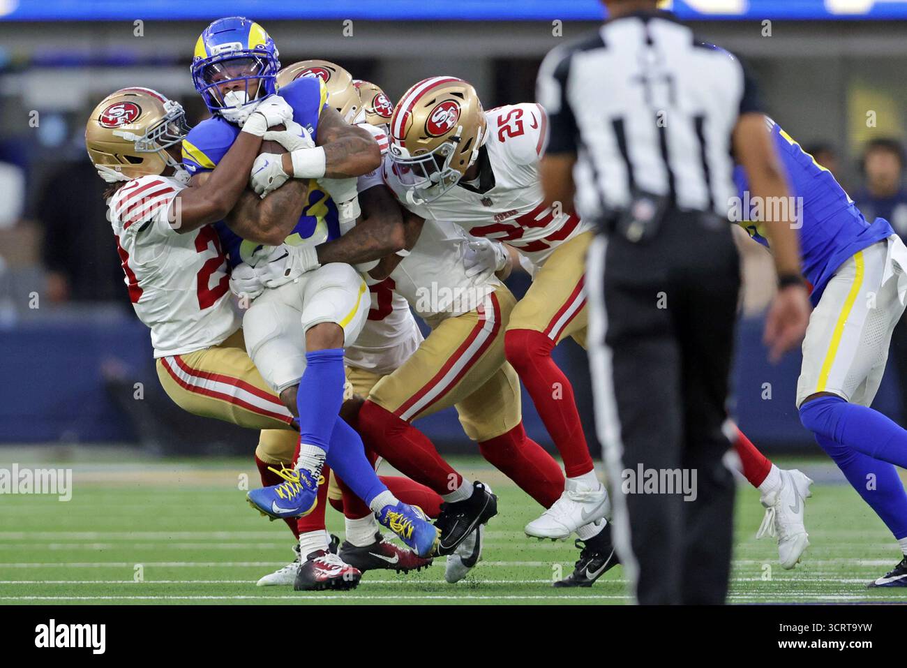 San Francisco 49ers' Upton Stout and teammates gang-tackle Los Angeles ...
