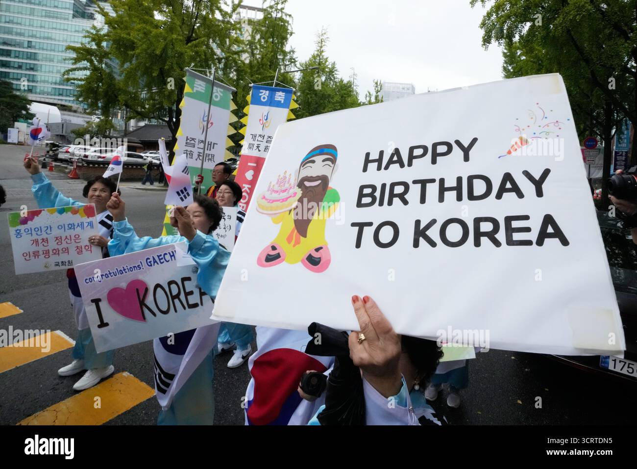 Participants attend a parade to celebrate the country's National ...