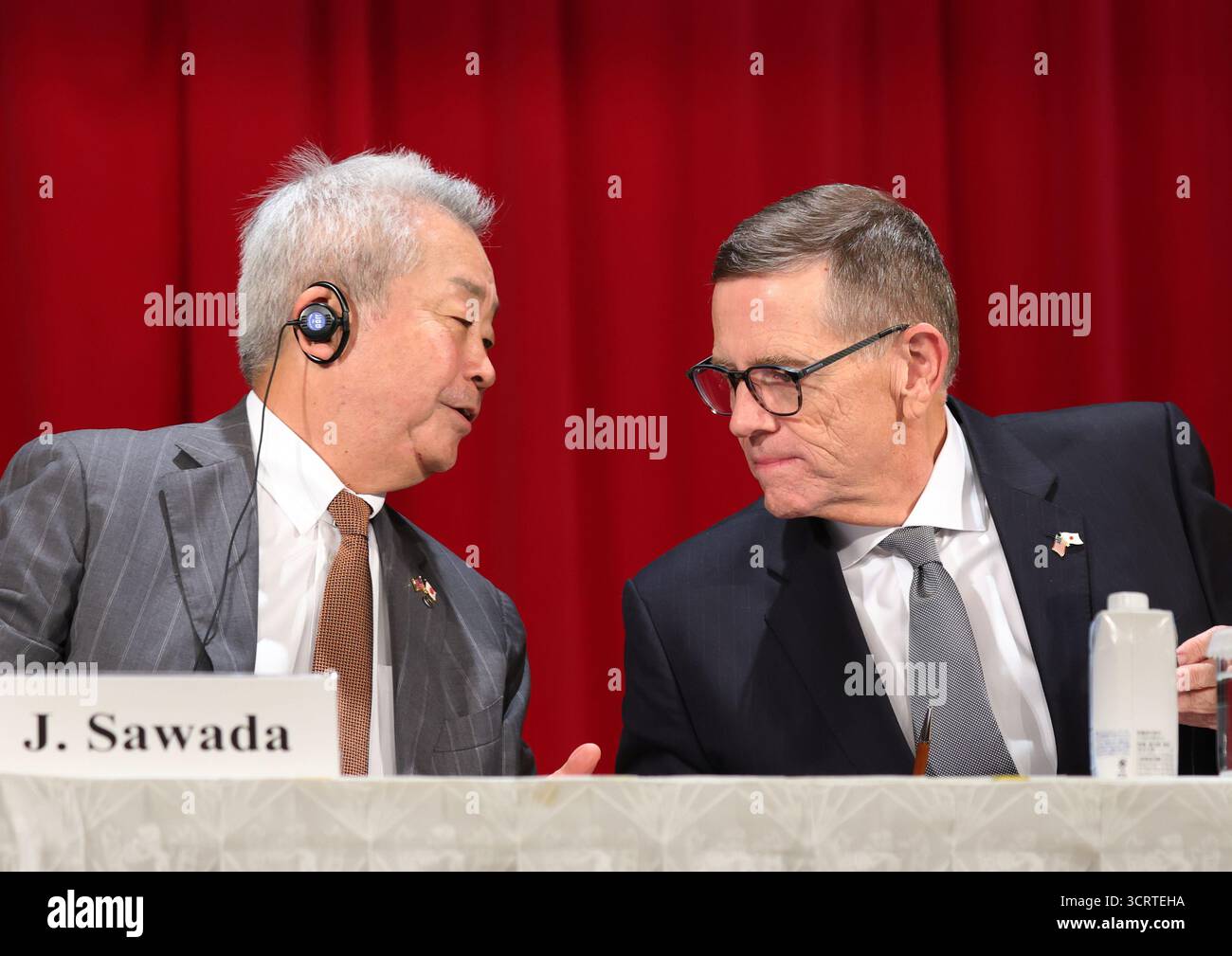Nippon Telegraph and Telephone (NTT) Chairman Jun Sawada (left) and ...