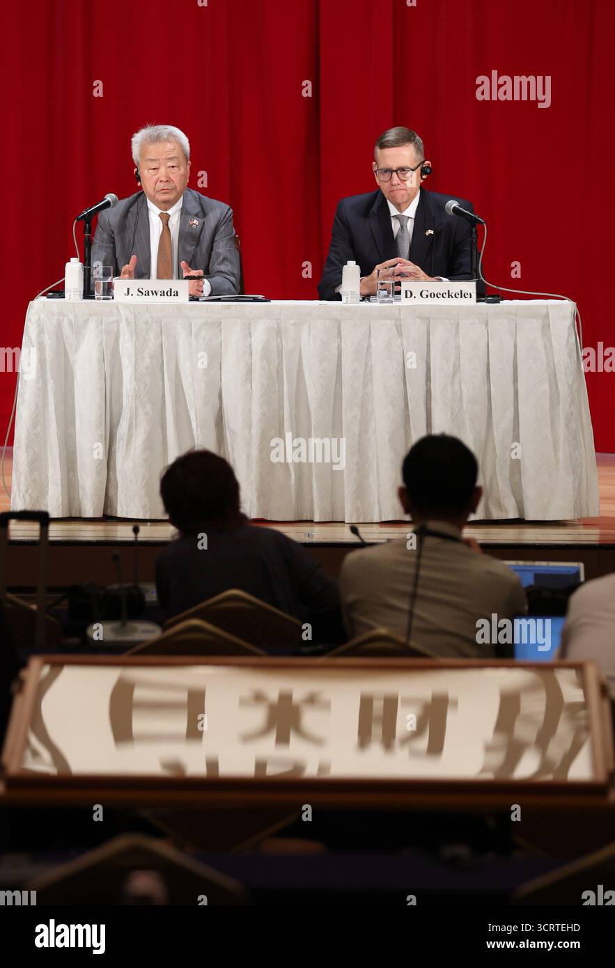 Nippon Telegraph and Telephone (NTT) Chairman Jun Sawada (left) and ...