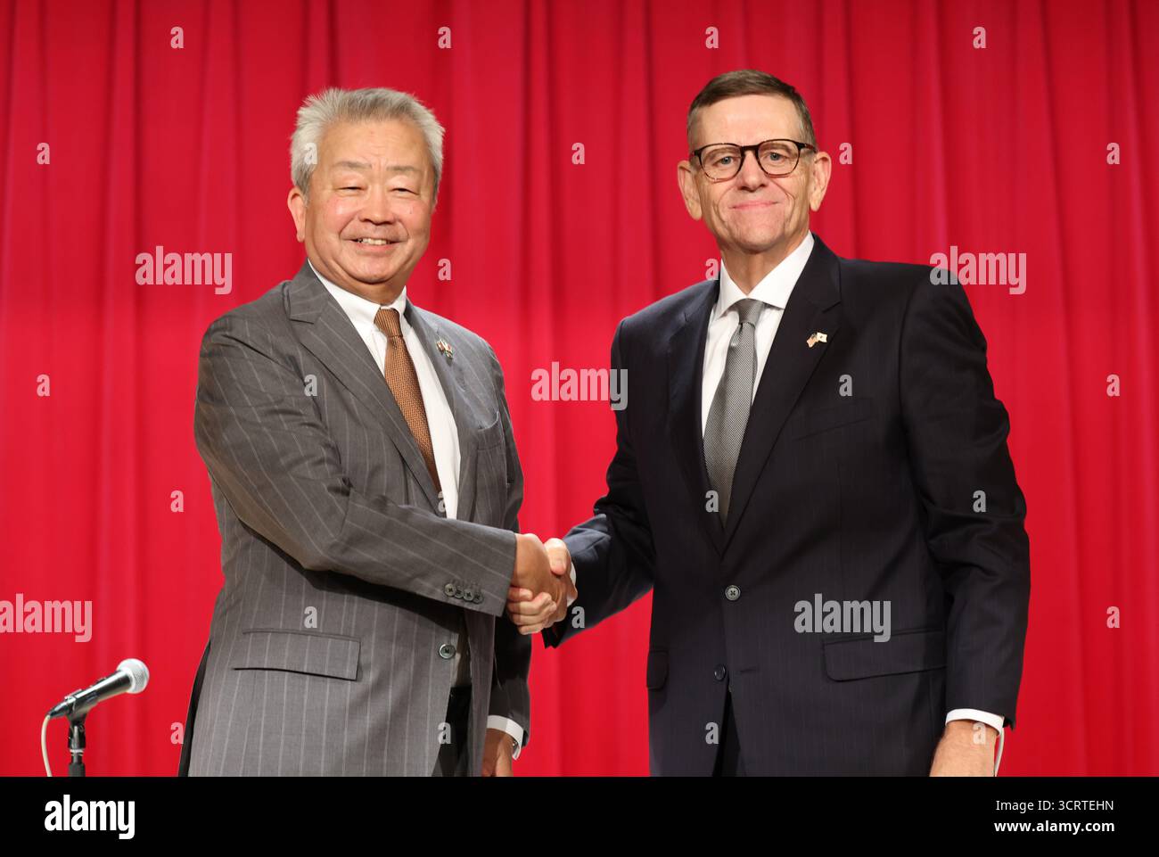 Nippon Telegraph and Telephone (NTT) Chairman Jun Sawada (left) and ...