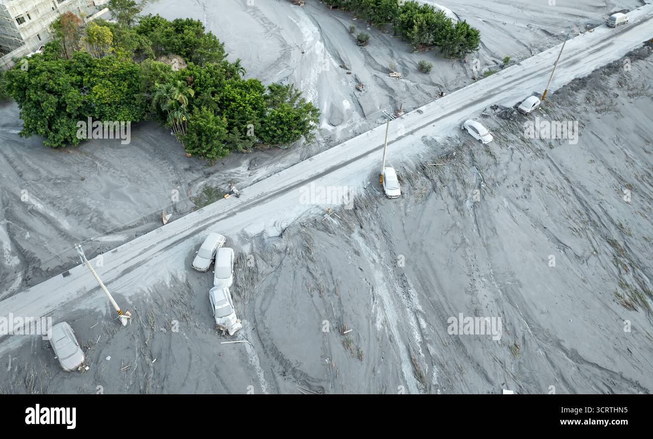 Aerial view of cars and roads covered in mud after flooding Stock Photo ...